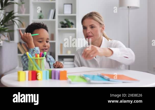 Adorable little african american boy with curly hair having fun at ...