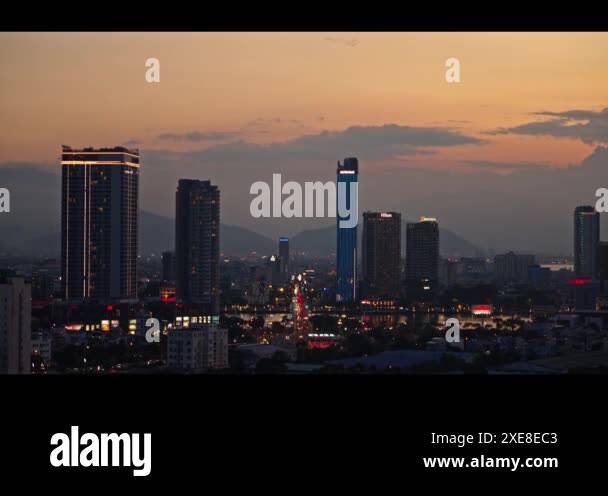 Vietnam, Da Nang, 06.01.2024 - A breathtaking view of the city during sunset, featuring ...