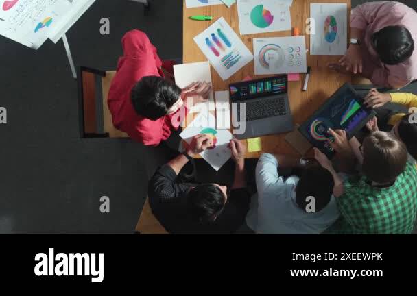 Top view of business team working together while talking about financial chart. Close up of ...