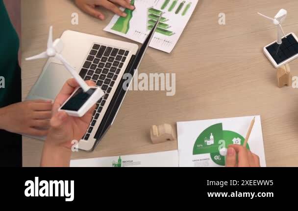 Excellent business team discussing on eco house project at meeting ...