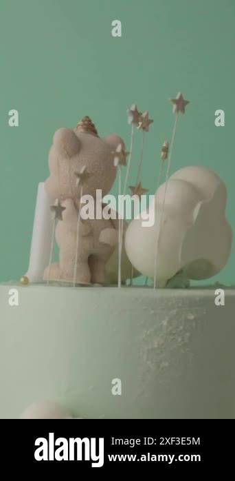 Rotating two tier birthday cake for a little kid with turquoise ...