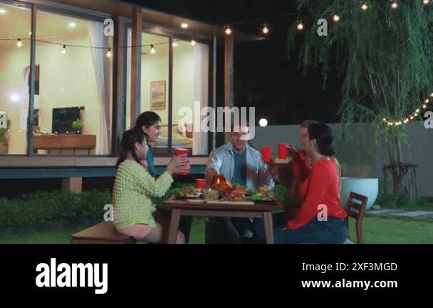 Family cheers with glass to celebrate holiday. Parents, grandparents ...