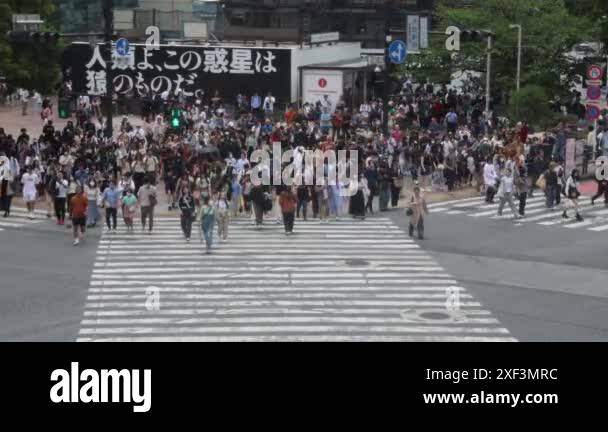 Tokyo, Japan- 12 May 2024: People cross the busy intersection in ...