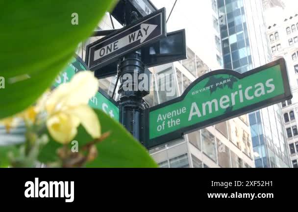 New York City crossroad, street intersection green road sign. 6 Sixth ...