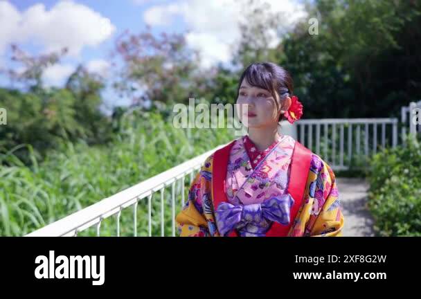 This captivating slow-motion video features a young Japanese woman in ...