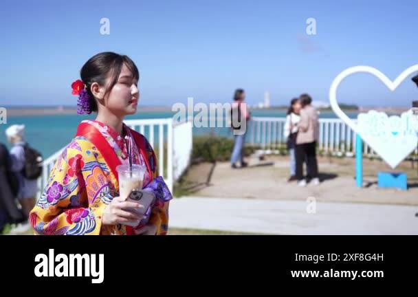 Slow-motion video of a Japanese woman in her 20s wearing Ryuso ...