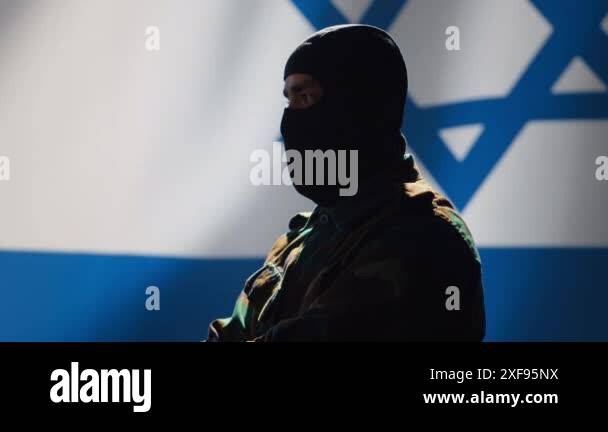 Mossad intelligence corps agent standing proud in front of Israel flag ...
