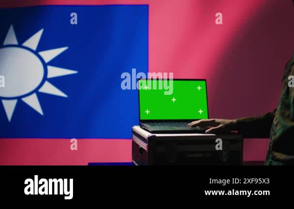 Taiwanese insurgent using military tech on green screen laptop to ...