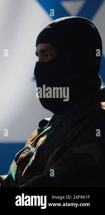 Vertical video Mossad intelligence corps agent standing proud in front ...