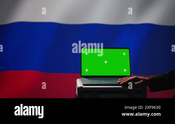 Russian soldier using military tech on green screen laptop to identify ...