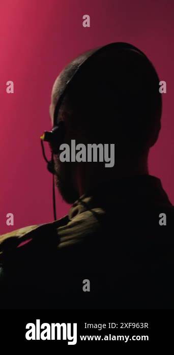 Vertical video Military dispatcher working for Chinese army relaying info for troops using ...