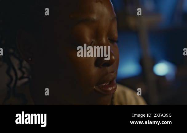 Side closeup of Black woman with ptsd breathing slowly and trying to ...