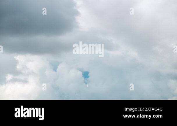 Close up view of some cumulus clouds during stormy weather timelapse ...