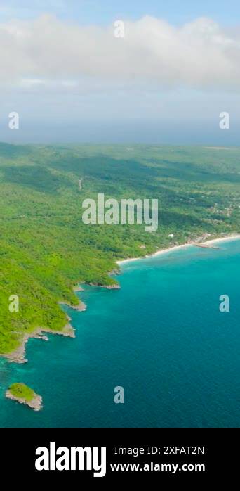 Tropical landscape of Carabao Island with blue sea and waves. San Jose ...