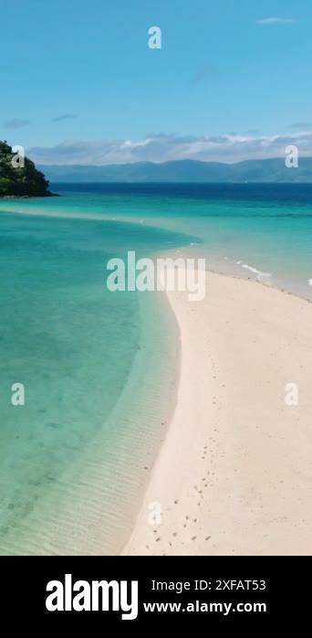 Ocean waves over sandbar in Romblon Island. Blue sky and clouds ...