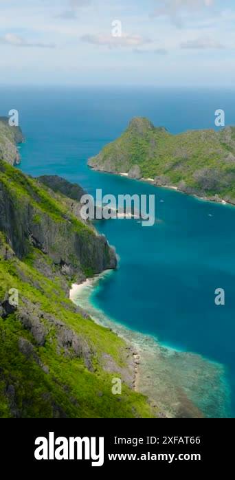 Islands with white Beaches. Tapiutan Island. Matinloc Island with blue ...