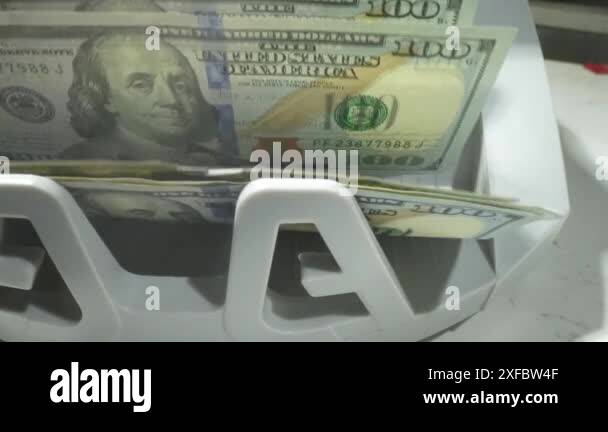 Money counting. Close up currency counting machine counting dollar ...
