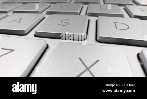 Keyboard of silver laptop features keys with English letters. Keyboard ...