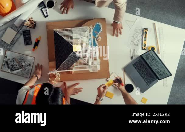 Top aerial view of architect engineer team stick sticky notes on house ...