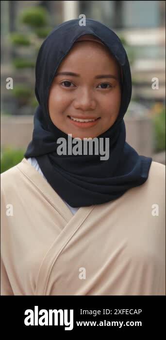 Vertical Video. Portrait of the Young Attractive Muslim Girl Standing Wearing Traditional ...
