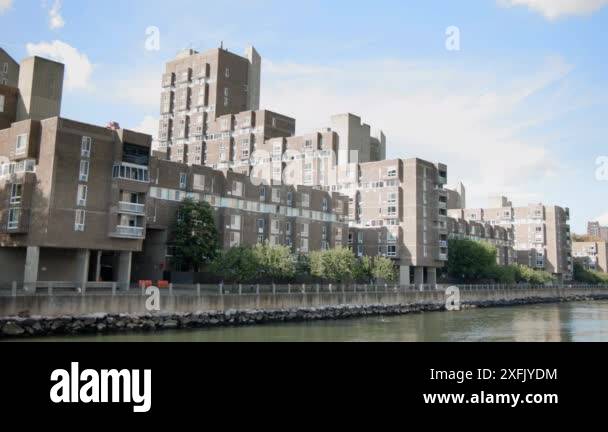 Frames showcasing architecturally distinct buildings along the water in ...