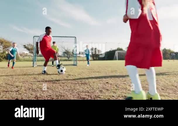 Football, player and children in stadium for shooting, practice and ...