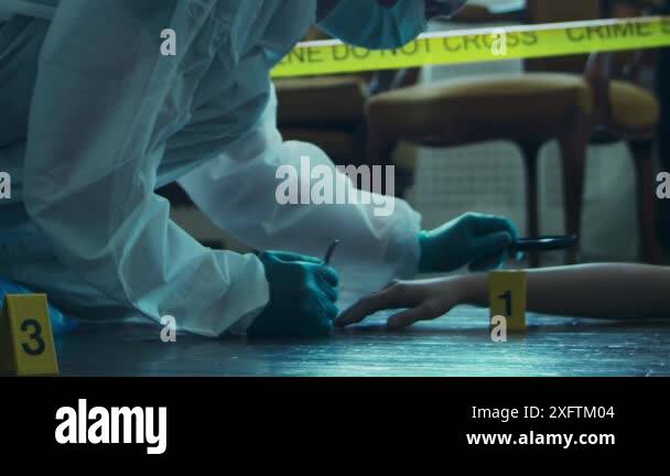 Detective Collecting Evidence in a Crime Scene. Forensic Specialists ...