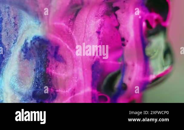 Luminous liquid. Neon ink flow. Defocused pink blue color shimmering ...