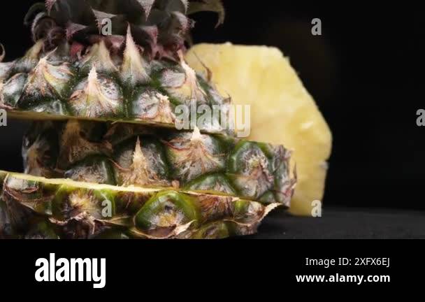 Close up video of fresh pineapple with slice of peel pineapple insert ...