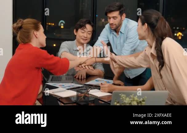 Businesspeople putting hands together and clapping hands to celebrate ...