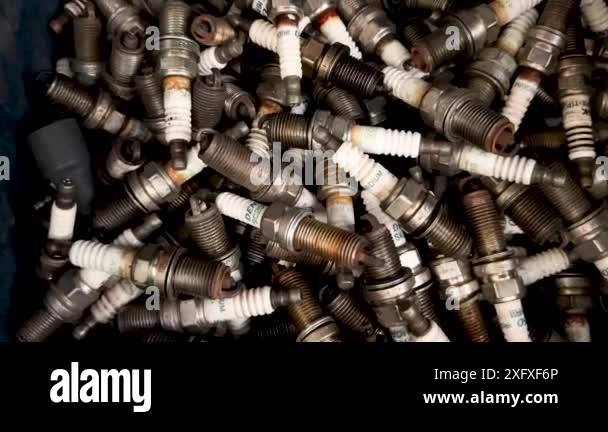 Pile of Used Spark Plugs. Used Spark Plugs Top View. Replacing old ...