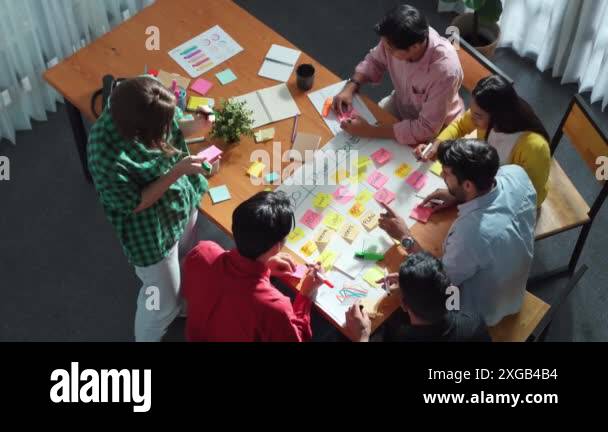 Close up of professional business team hands writing and putting sticky ...