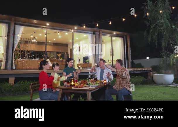 Happy family holding glowing sparkler in holiday celebration party at ...