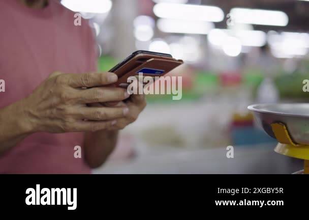 close-up slow motion hands of a mature Asian man manipulating the ...