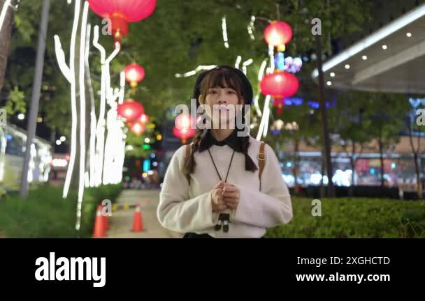 Slow-motion video of a young and cute Taiwanese woman in her 20s ...