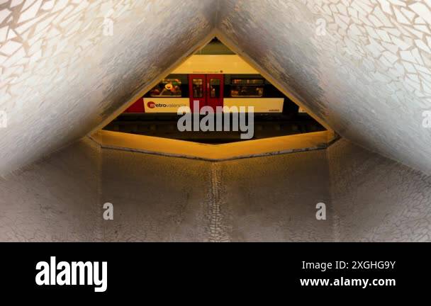 Subway train seen through modern geometric architecture. The image ...