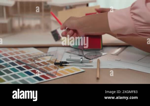 Slow motion interior designer using architectural equipment draw a ...