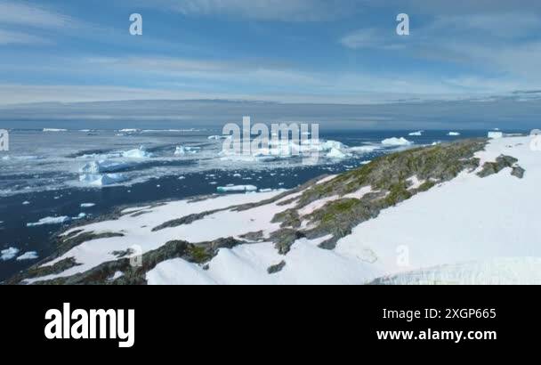 Pristine Antarctic winter landscape in sunny day. Mountain rock glacier ...