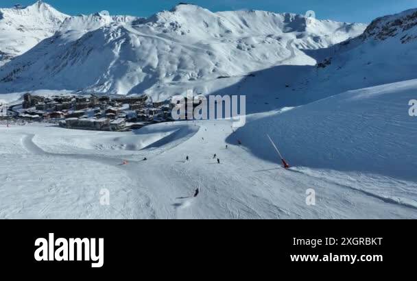 Winter drone shot of ski pistes and slopes covered with fresh powder ...