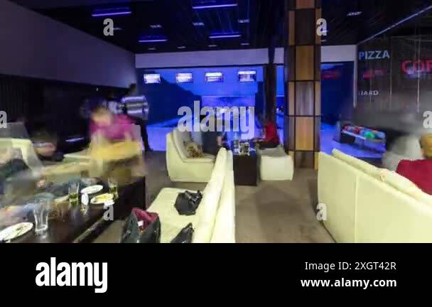 People hanging out at bowling area of entertainment complex in shopping ...