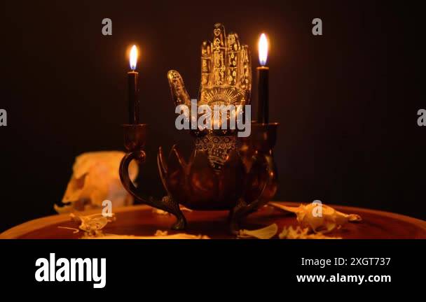 Fortune teller hand or palmistry on the witch table with animal bones ...