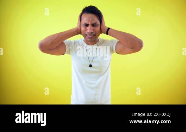 Frustrated man covering ears, Young person crying sadly, An anxious men ...