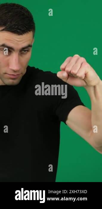 Boxing pose guy. emotions of a handsome man guy on a green background ...