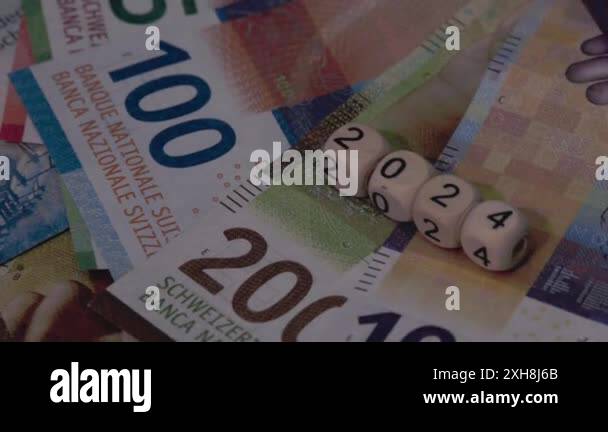 Swiss Francs And The Numbers 2024 On Dice Stock Video Footage - Alamy