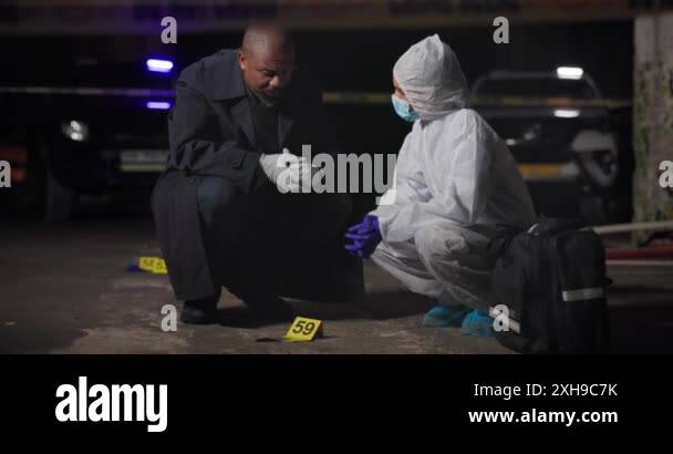 Crime scene, detective and forensic team in discussion with evidence ...
