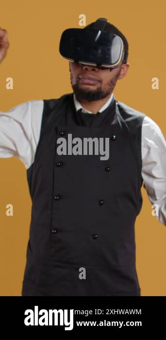 Vertical Video Restaurant waiter uses virtual reality headset with ...