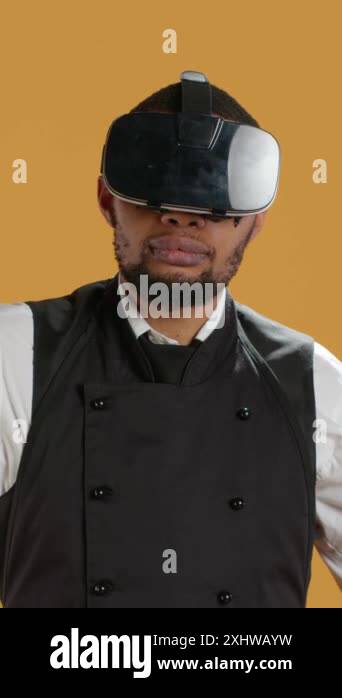 Vertical Video Restaurant waiter uses virtual reality headset with ...
