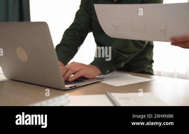 Architect and engineer compare hand writing draft with construction ...