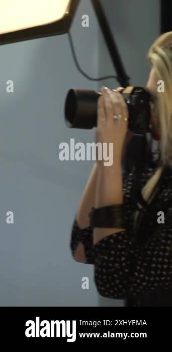 Vertical video. Photoshoot process. Backstage fashion. Professional ...