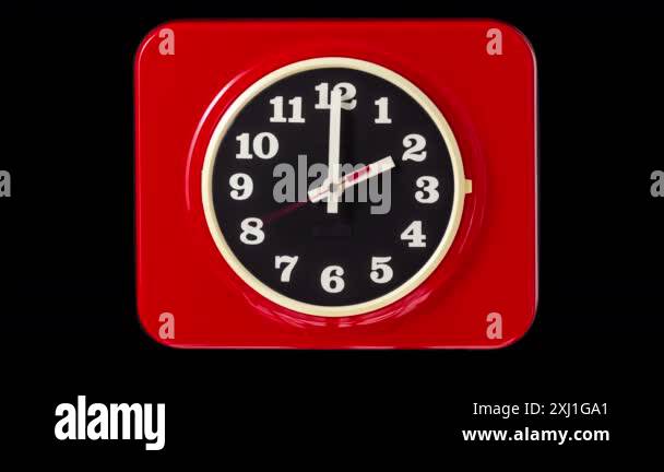 Retro red analogue clock passing 12 hours in stop motion Stock Video Footage - Alamy